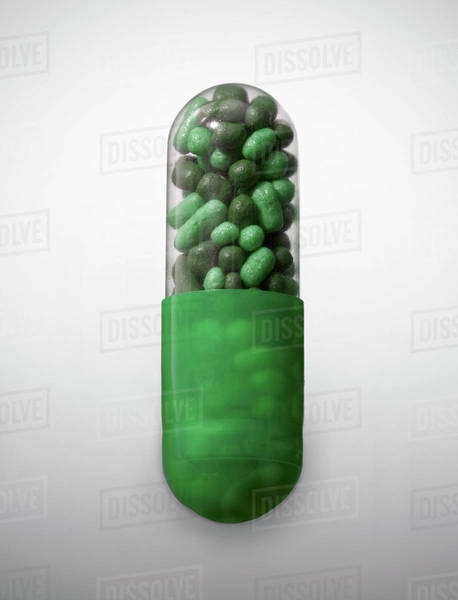 A vibrant green capsule pill, close-up - Royalty-free Stock Photo ...