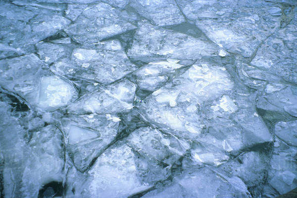 Patterns of cracked ice on river - Royalty-free Stock Photo | Dissolve