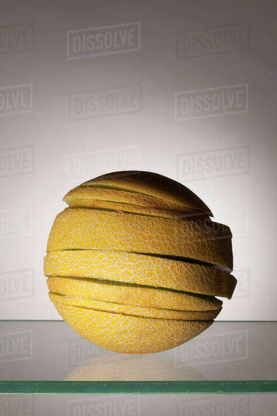 Uneven slices of lemon stacked to comprise the shape of a lemon ...