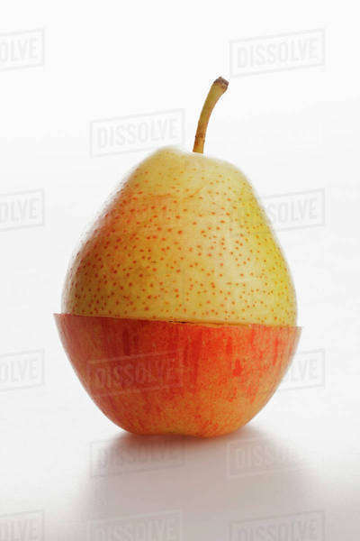 Two pieces of different fruit stacked to comprise the shape of a piece ...