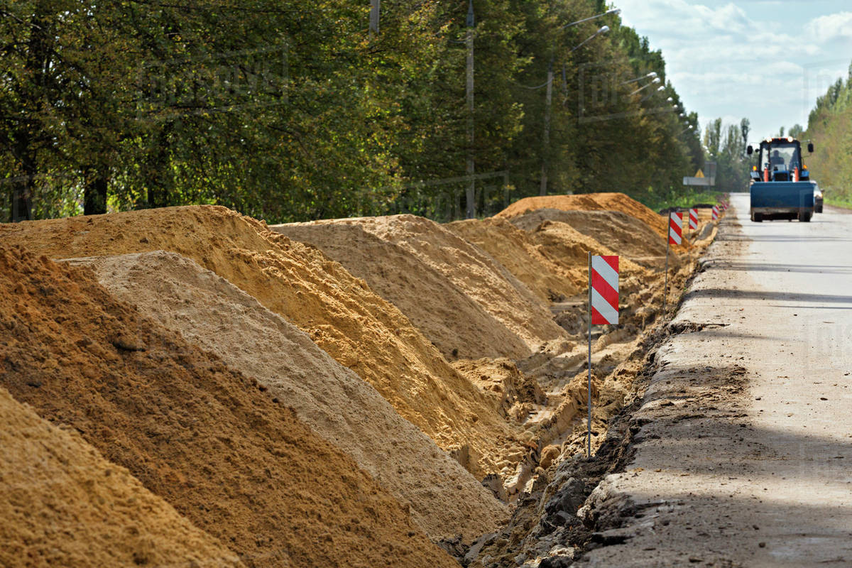 Range of sand mounds on roadside - Royalty-free Stock Photo | Dissolve