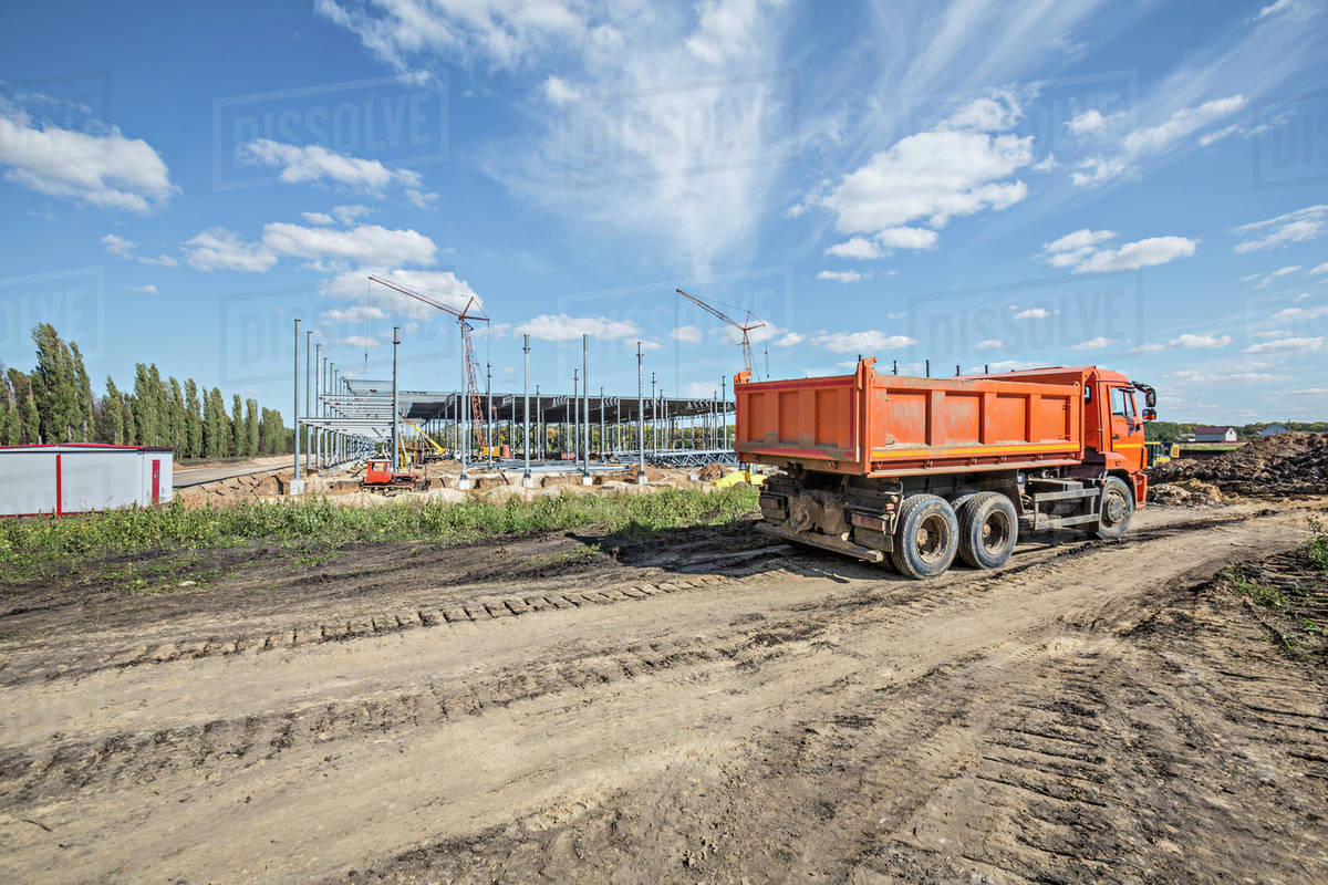 Dumper truck parked on dirt track at construction site - Royalty-free ...
