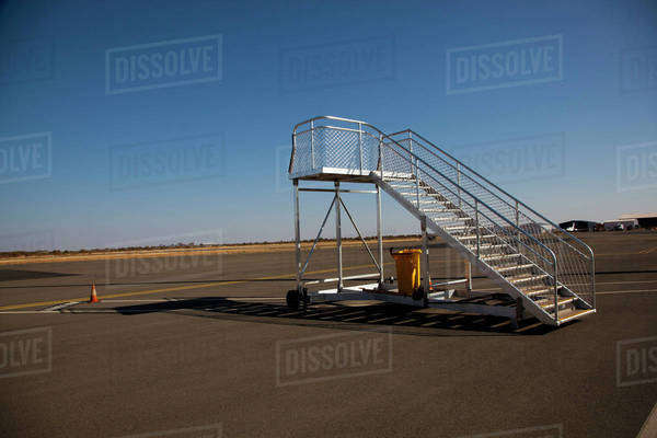 Mobile steps on an airport runway - Stock Photo - Dissolve