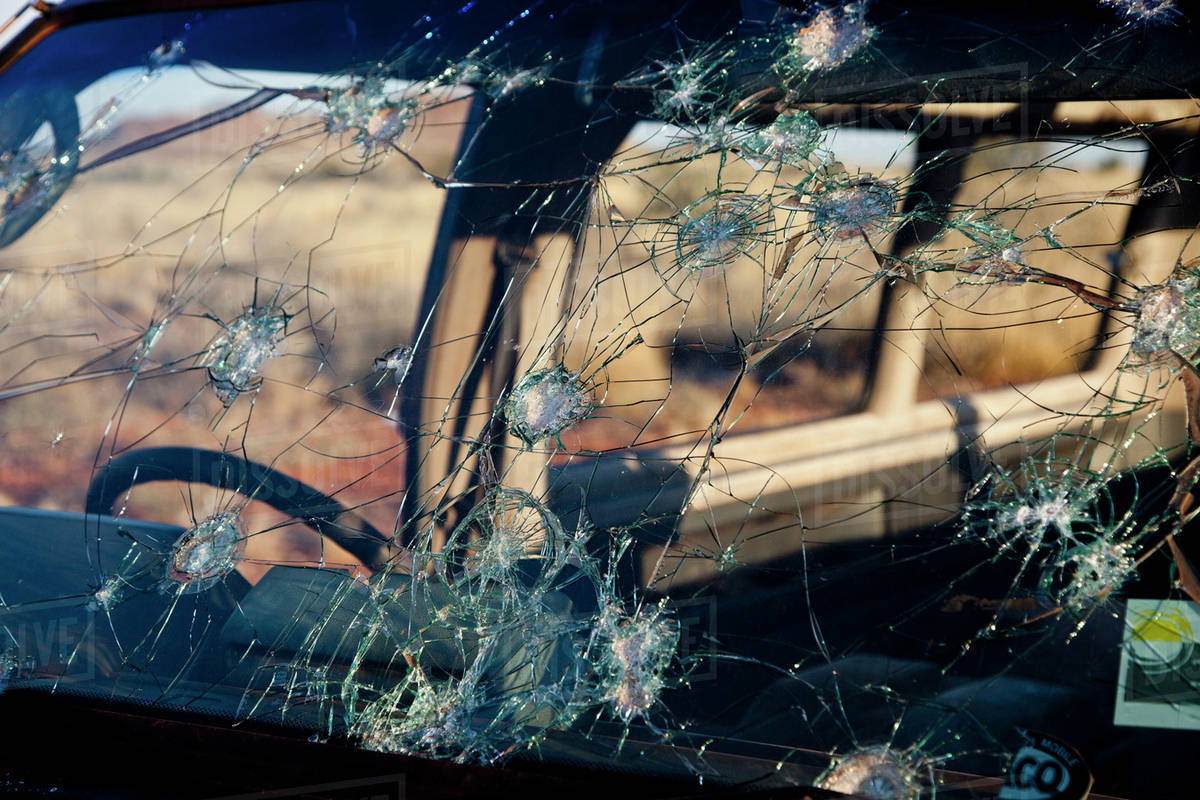 Detail of holes in a windshield - Stock Photo - Dissolve