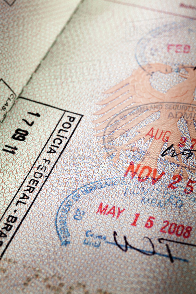 An open passport with several entrance stamps on the pages - Royalty ...