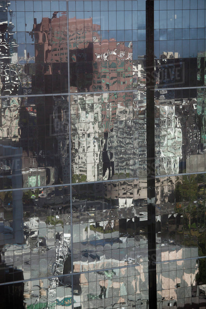 Distorted reflections of city skyscraper in Melbourne, Victoria ...