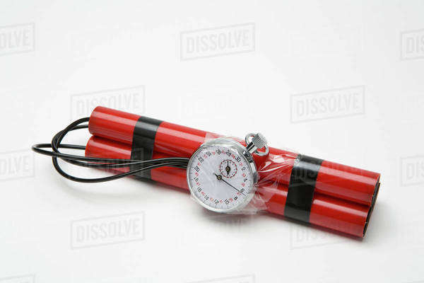 A time bomb made with dynamite and a stopwatch - Stock Photo - Dissolve