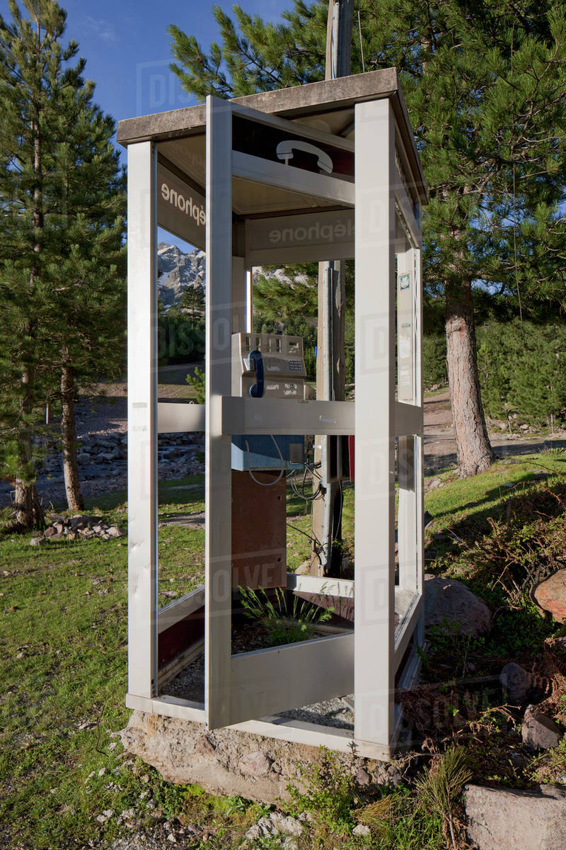A phone booth in a remote location in nature - Stock Photo - Dissolve