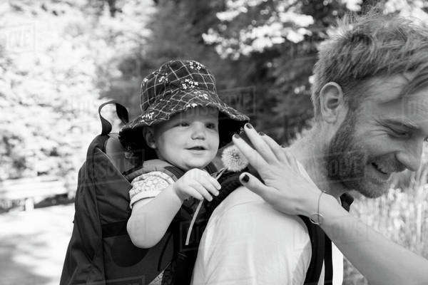 Father carrying his son in baby carrier - Royalty-free Stock Photo ...