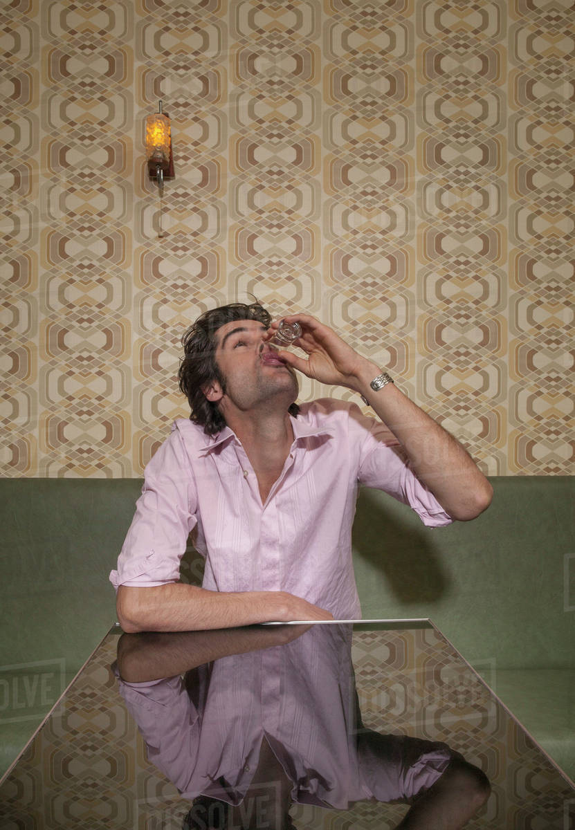 A man drinking a shot - Royalty-free Stock Photo | Dissolve