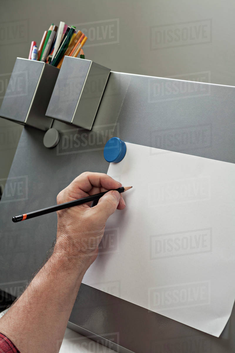 Man drawing on paper - Royalty-free Stock Photo | Dissolve