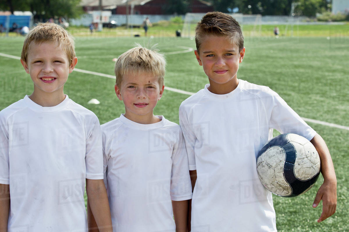 Portrait of boys with football - Royalty-free Stock Photo | Dissolve