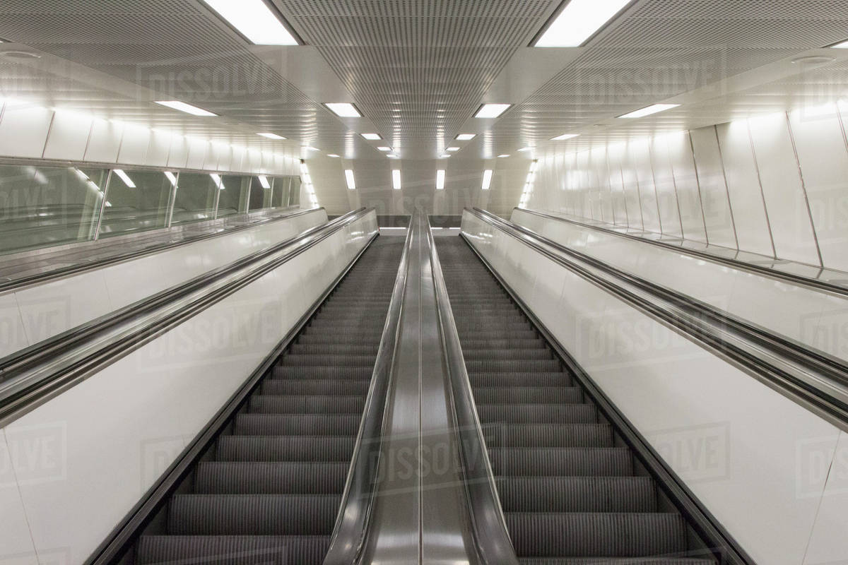 Two escalators side by side - Royalty-free Stock Photo | Dissolve