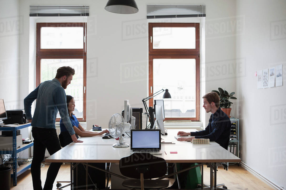 Business people working at computer desk in office - Royalty-free Stock ...