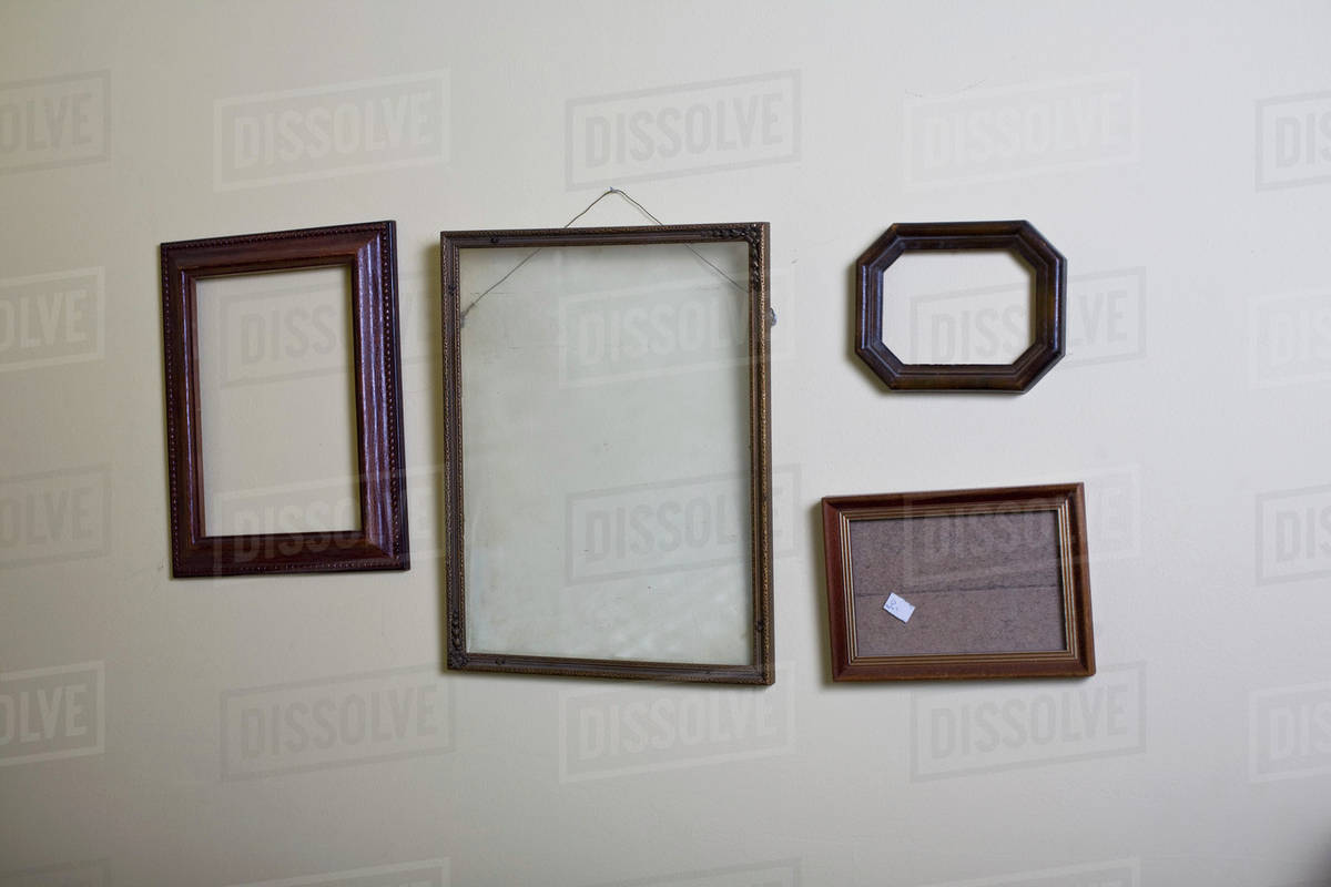 Empty picture frames hanging on a wall - Royalty-free Stock Photo ...