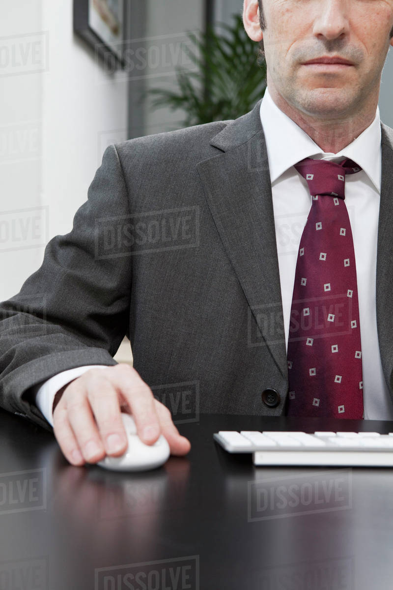 Businessman with mouse - Royalty-free Stock Photo | Dissolve