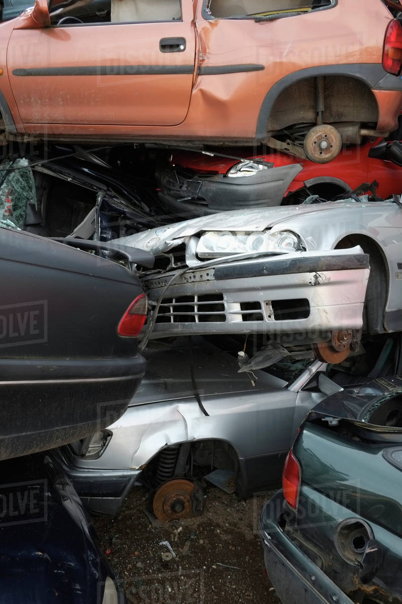 Cars stacked in scrap yard - Royalty-free Stock Photo | Dissolve