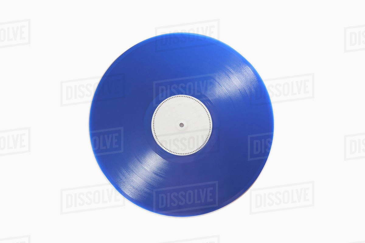 Close-up of blue record on white background - Stock Photo - Dissolve