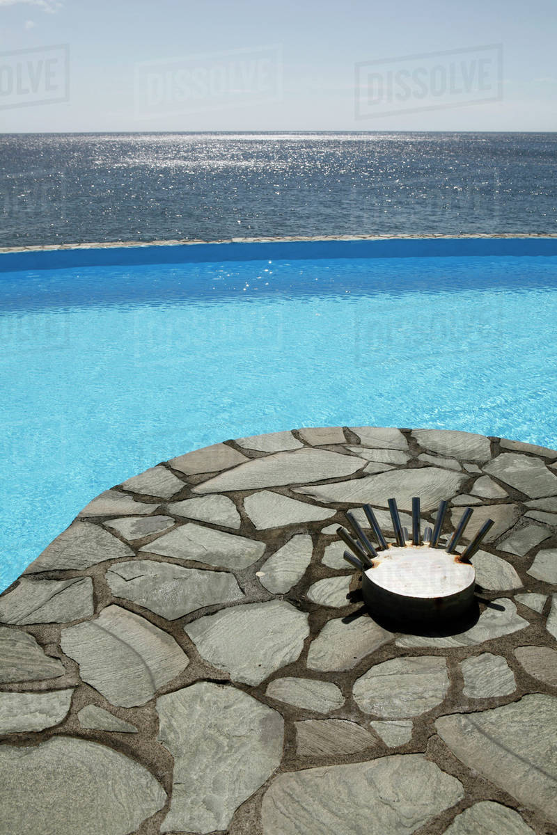 Detail of a swimming pool next to the sea - Stock Photo - Dissolve