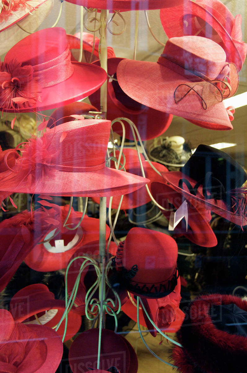 A variety of red hats on display in a hat shop - Royalty-free Stock ...