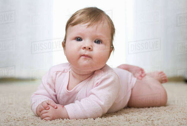 A baby looking at camera, portrait - Royalty-free Stock Photo | Dissolve