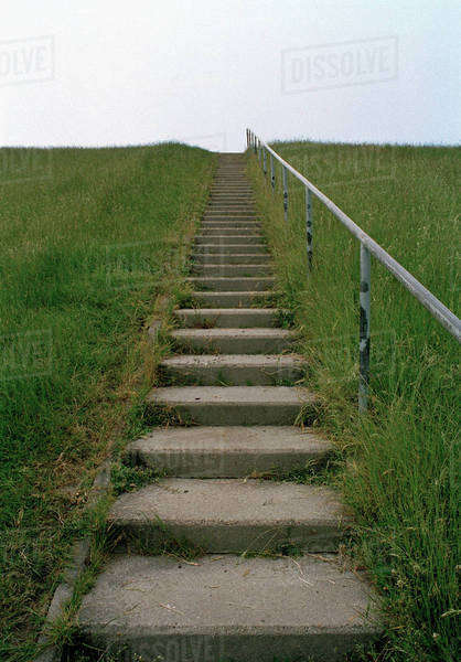 Stairs up a grassy hill - Royalty-free Stock Photo | Dissolve