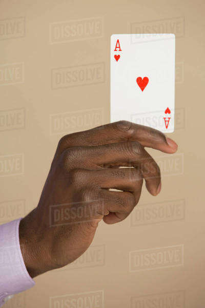 Cropped hand holding ace card against colored background - Stock Photo ...