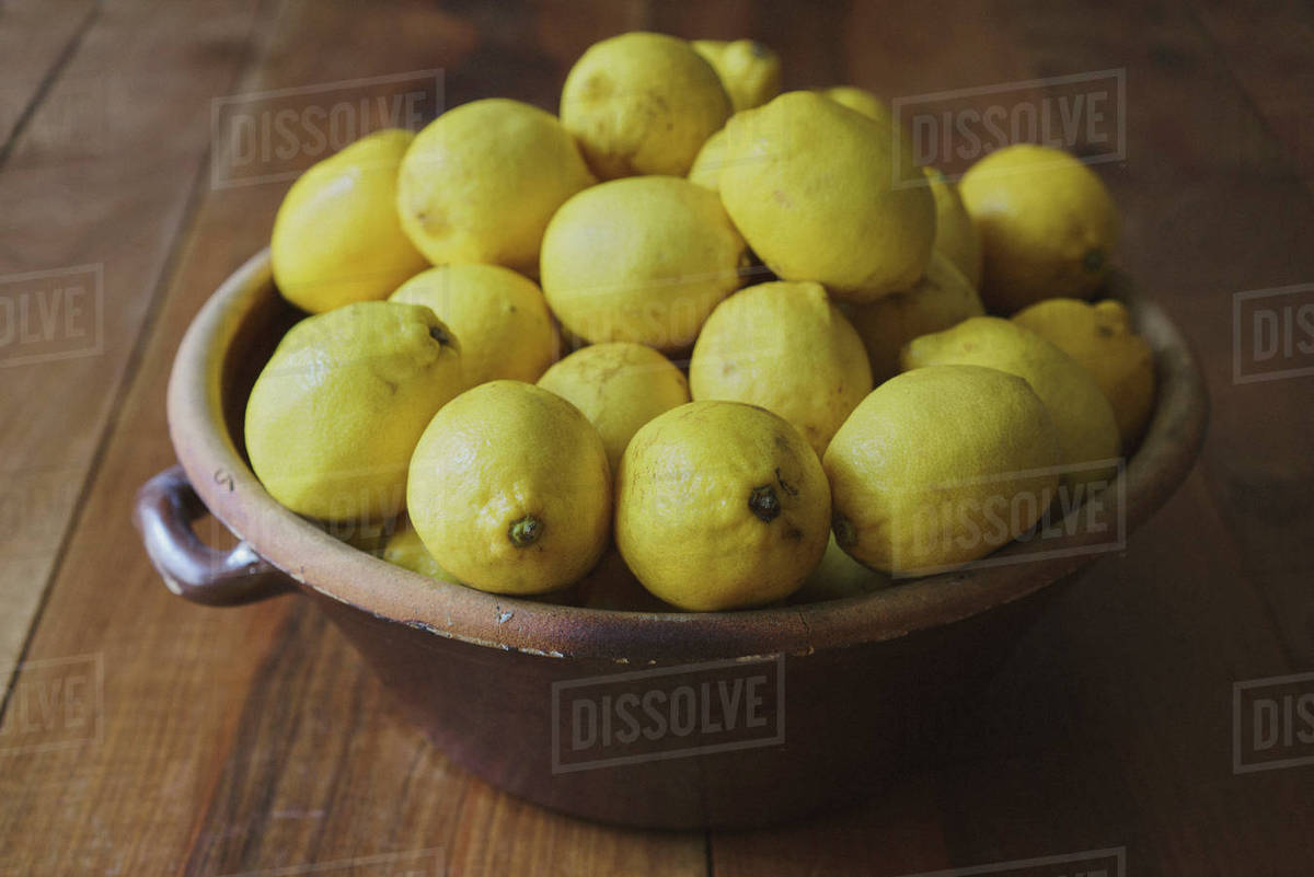 Close-up of lemons in container on table - Royalty-free Stock Photo ...