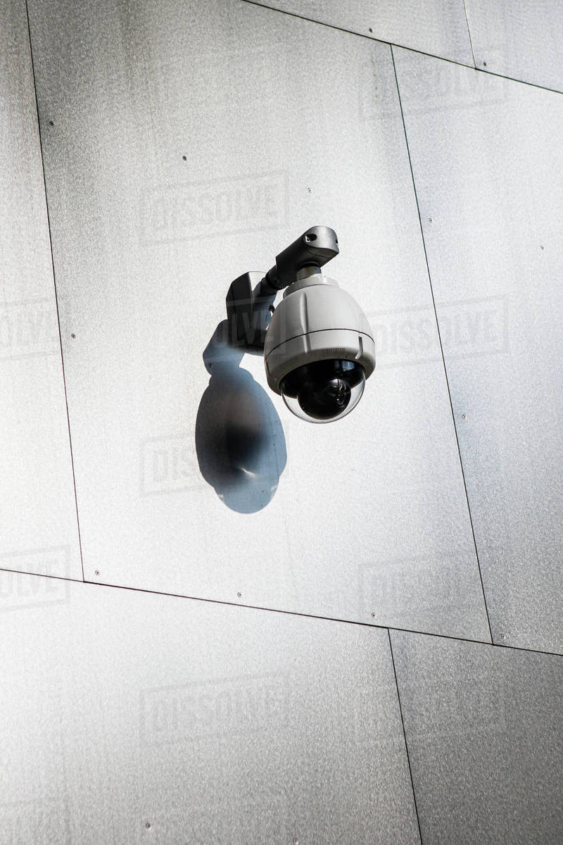 Close-up of security camera mounted on wall - Stock Photo - Dissolve
