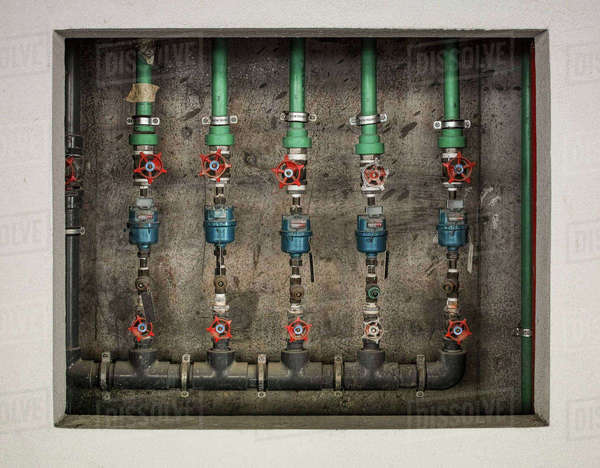Water meters in wall - Stock Photo - Dissolve