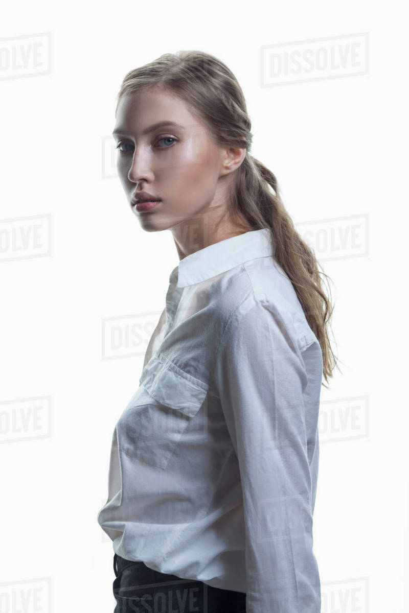 Side view portrait of beautiful fashion model against white background ...