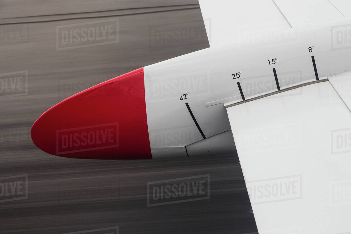 Cropped image of red and white aircraft wing with numbers - Royalty ...