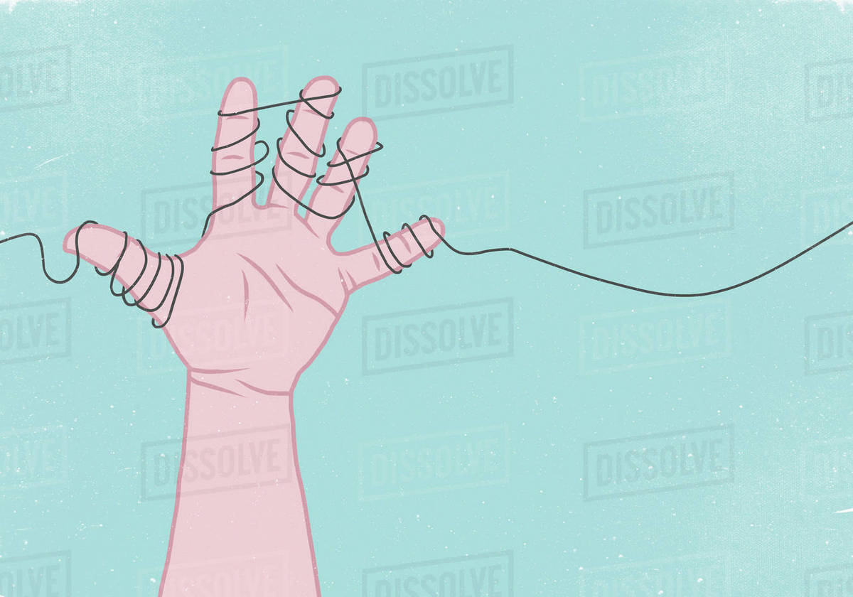 Cropped image of hand wrapped in thread against blue background ...