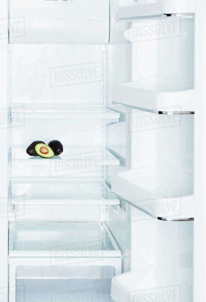 Avocados in open, empty white refrigerator - Royalty-free Stock Photo ...
