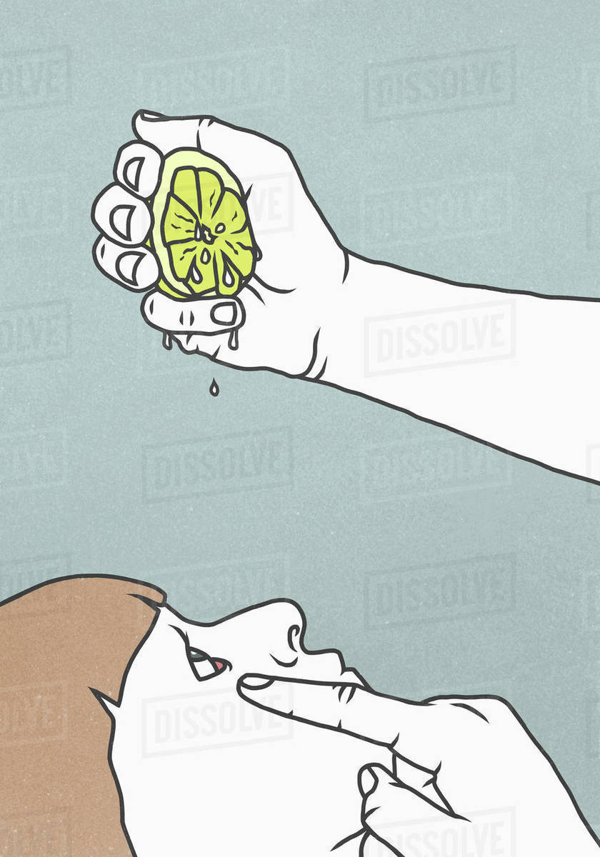 Hand squeezing lemon into womans eye - Royalty-free Stock Photo | Dissolve