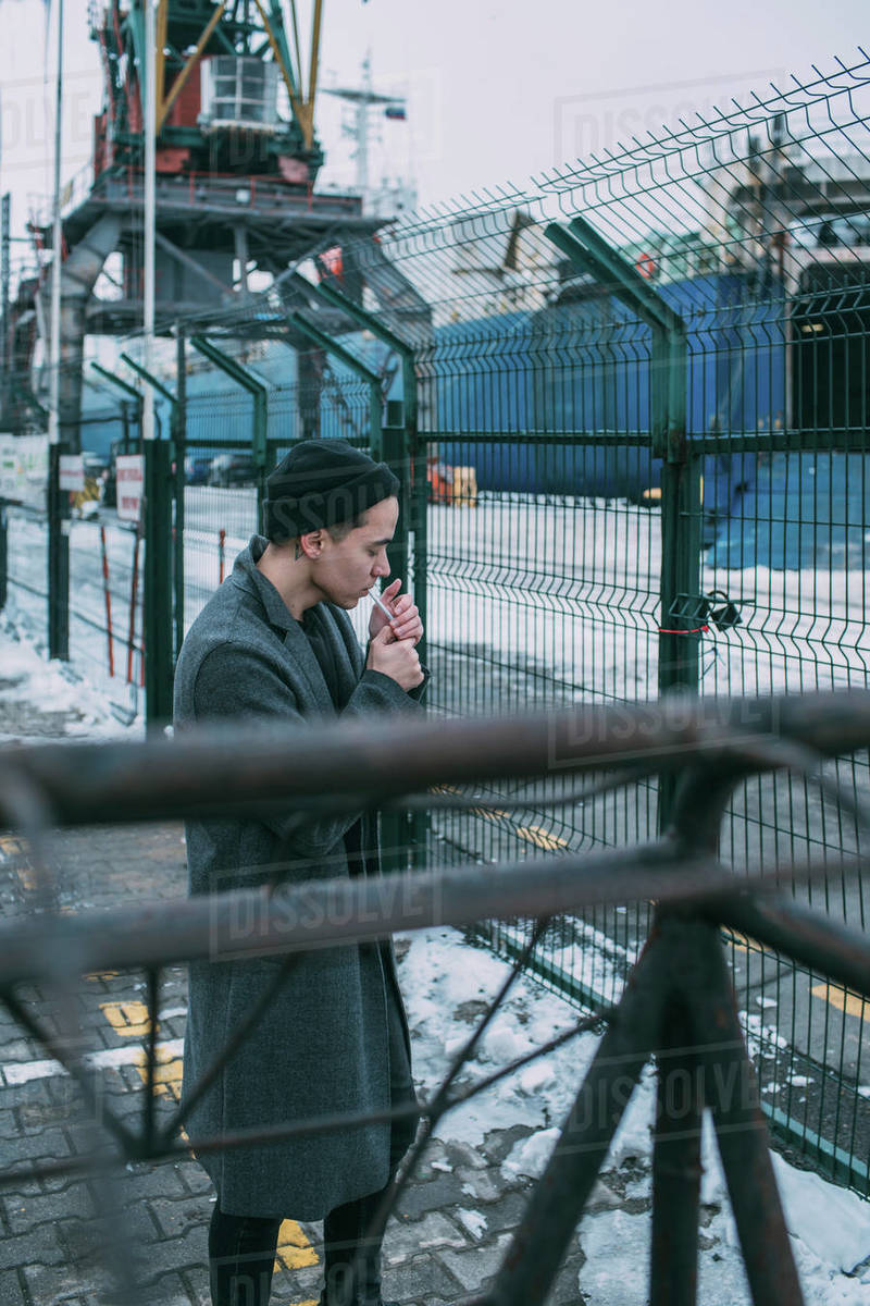Shipyard worker smoking - Stock Photo - Dissolve