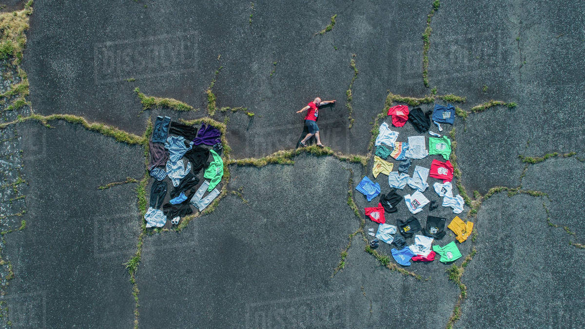 Knolling of man walking on crack between clothing wardrobe - Royalty ...