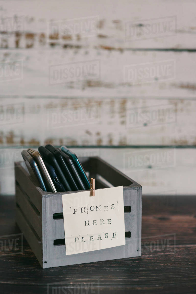 Mobile phone holder with sign - Royalty-free Stock Photo | Dissolve