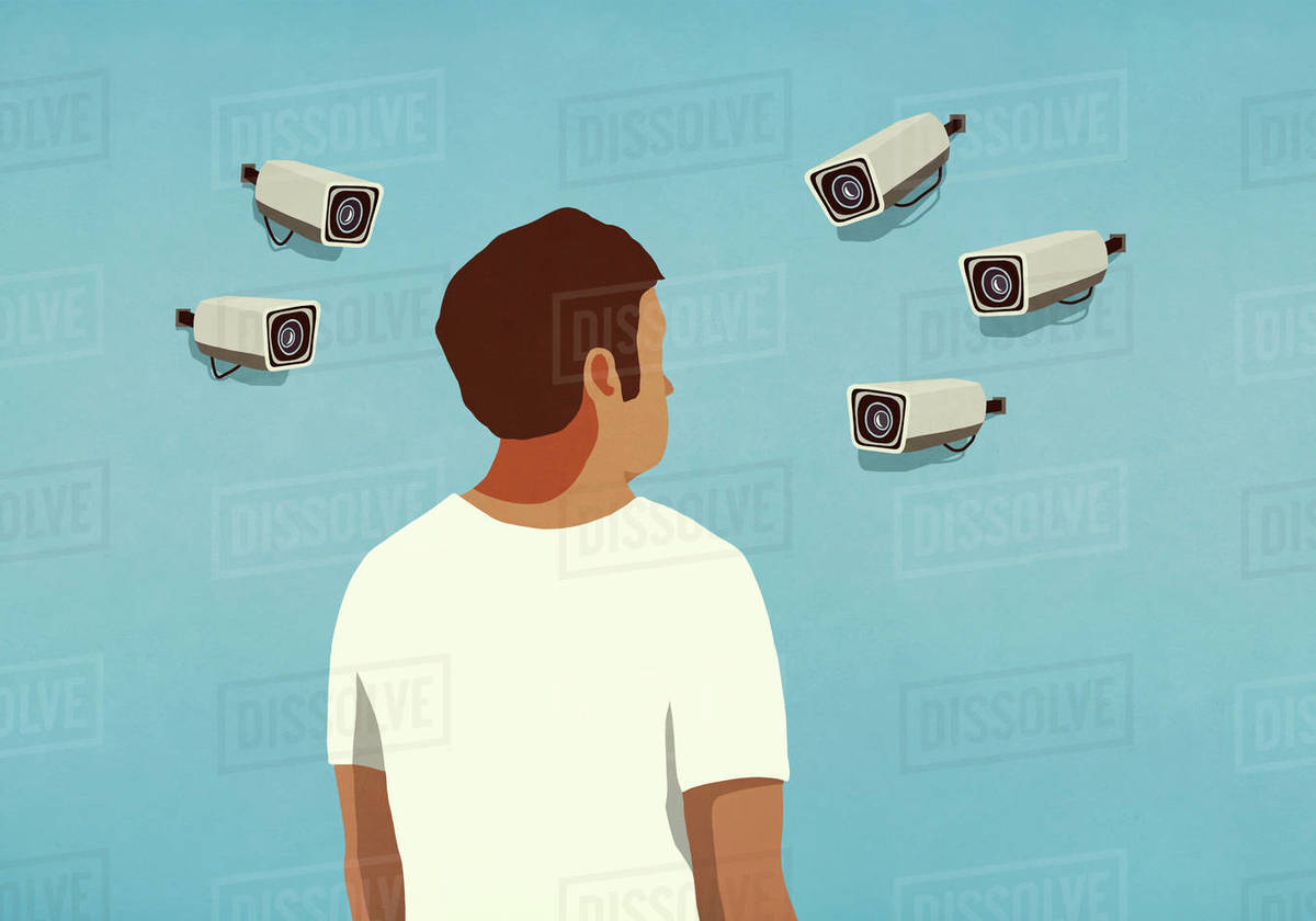 Surveillance cameras pointed at man - Royalty-free Stock Photo | Dissolve