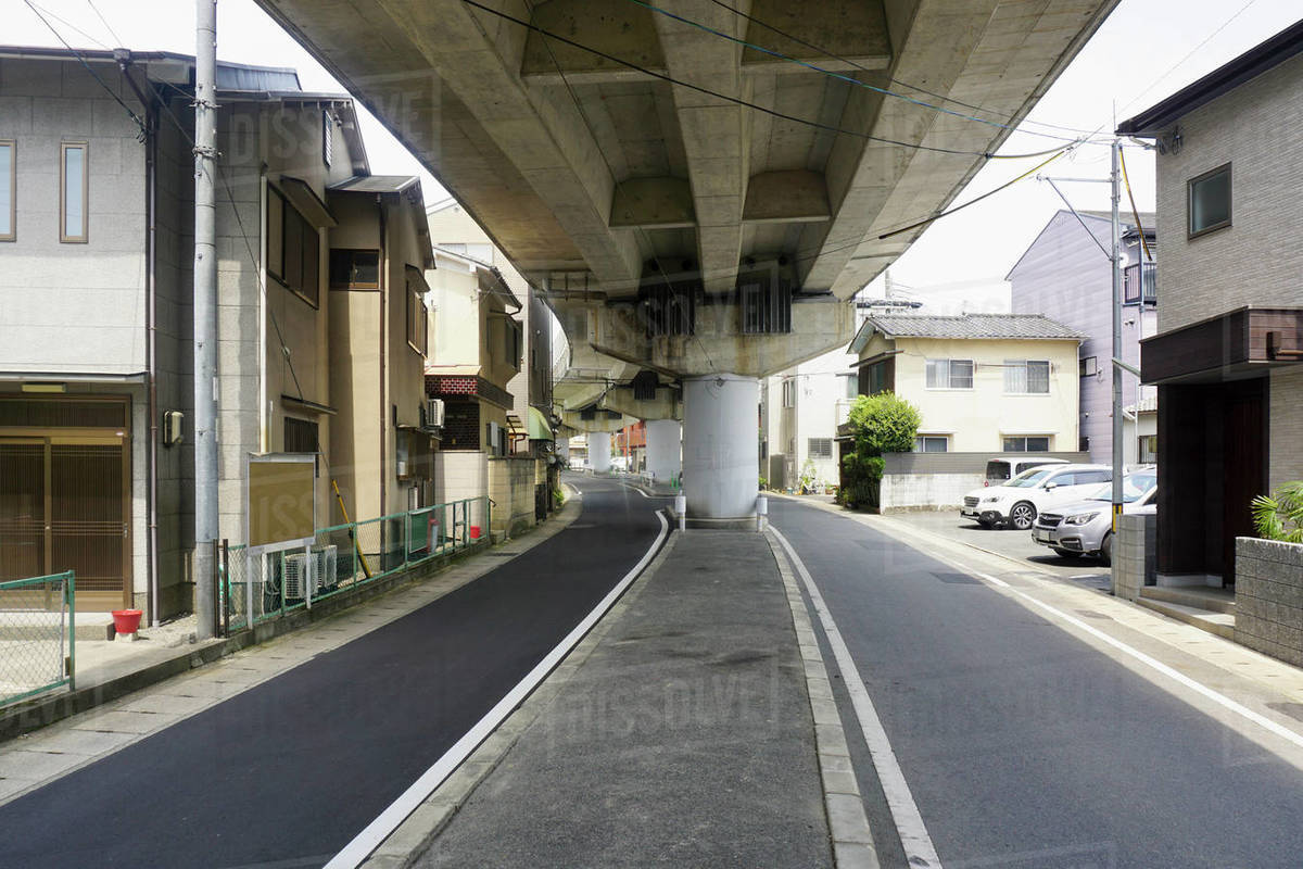 Overpass and street splitting urban neighborhood, Kyoto, Japan - Stock ...