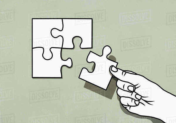 Hand finishing jigsaw puzzle with missing piece - Stock Photo - Dissolve