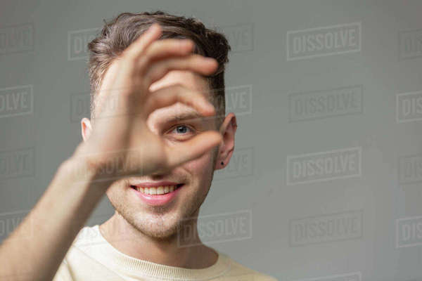 Young man gesturing - Royalty-free Stock Photo | Dissolve