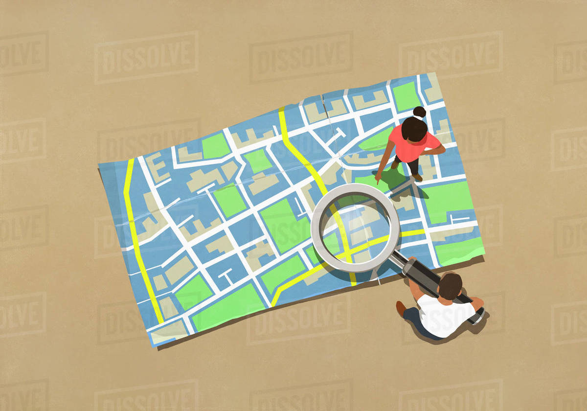 Couple with magnifying glass over map - Stock Photo - Dissolve