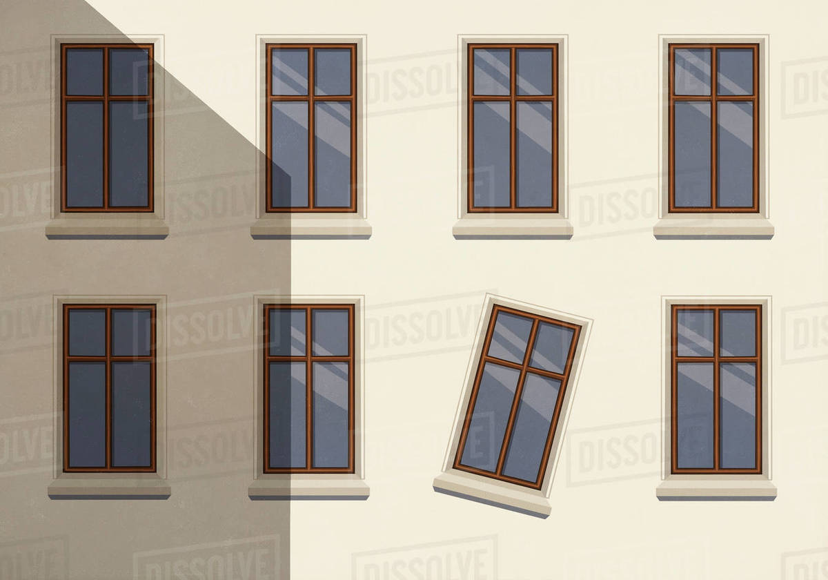 Tilted window on sunny building wall - Stock Photo - Dissolve