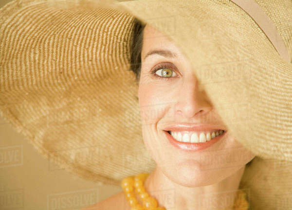 Woman wearing straw hat - Stock Photo - Dissolve