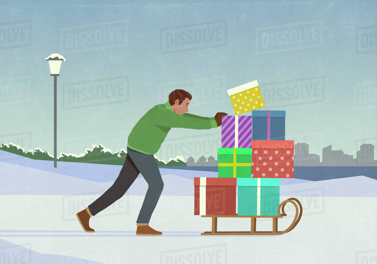 Man pushing sled stacked with Christmas gifts in snowy winter city park ...
