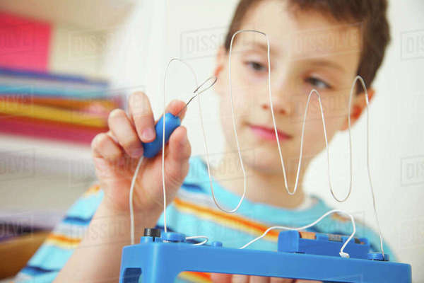Boy Playing with Wire Coordination Game - Royalty-free Stock Photo ...