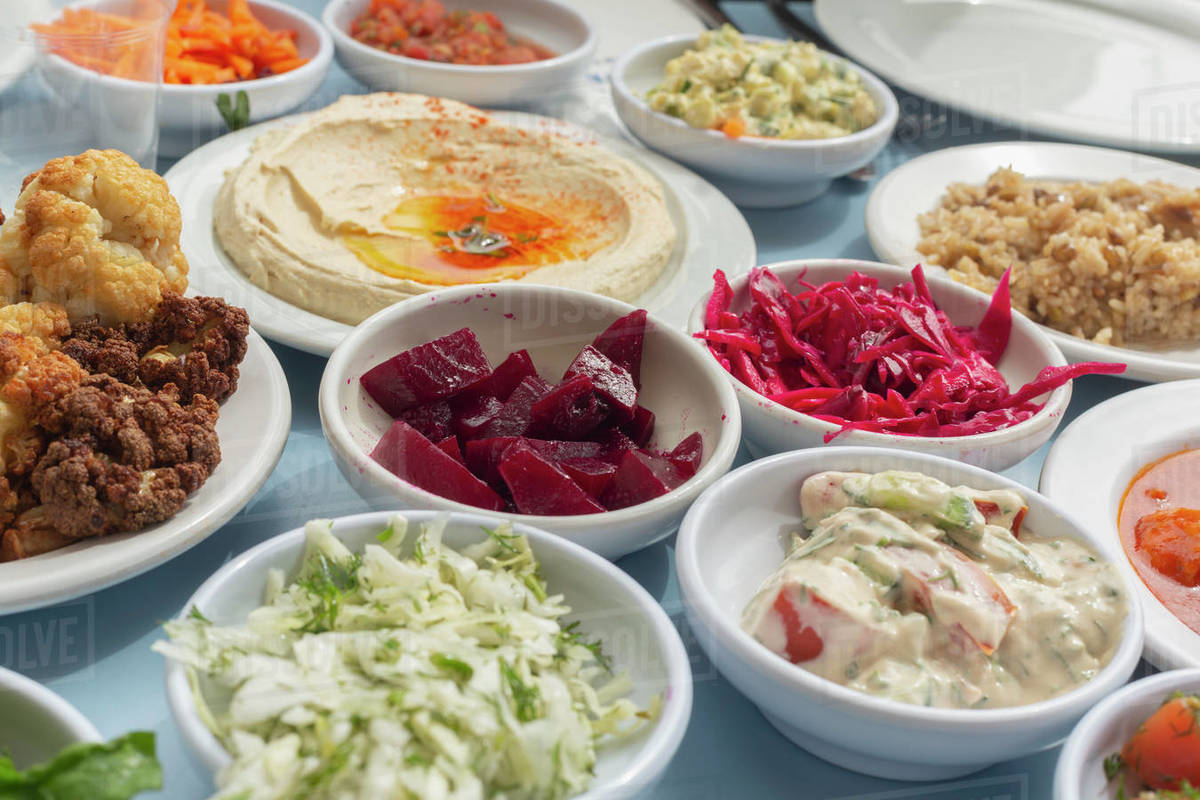 Still life close up Israeli meze appetizers in bowls on table - Royalty ...
