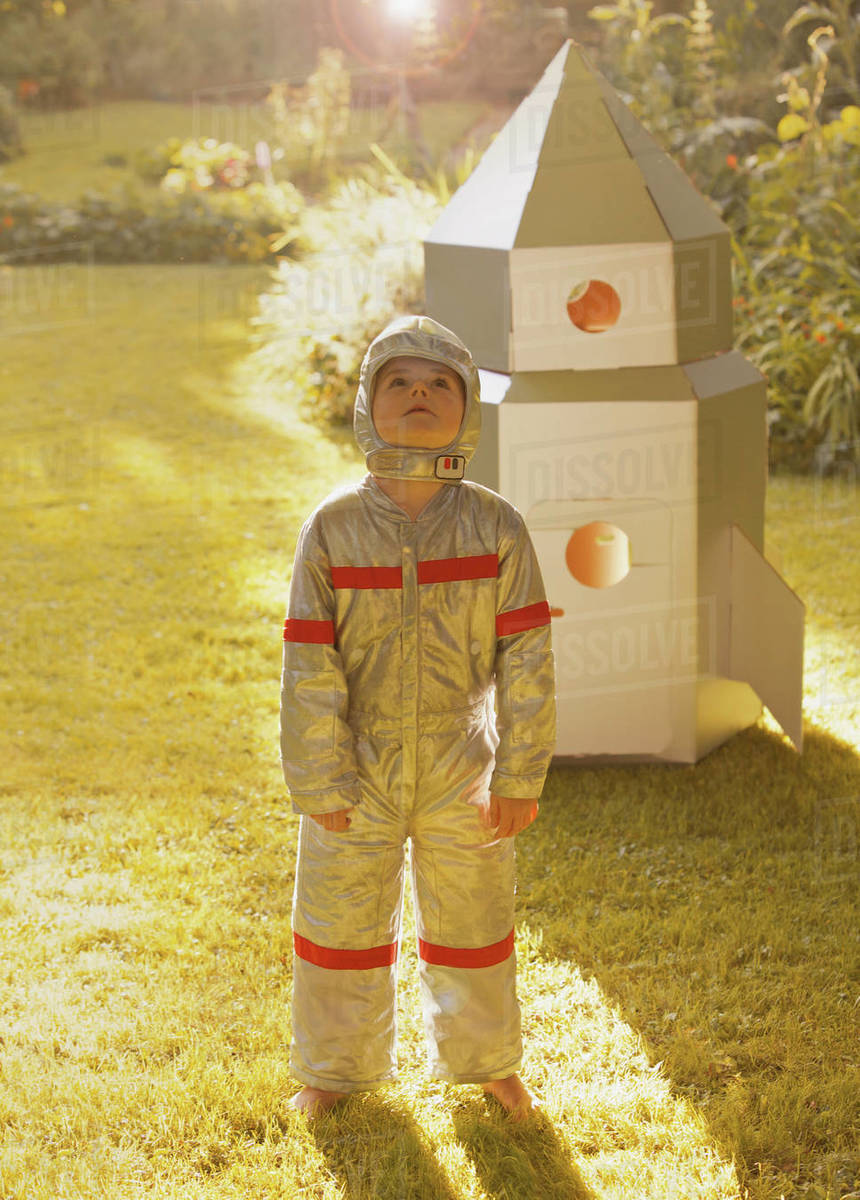 Boy Wearing Space Suit Standing in front of Cardboard Rocket Spacecraft ...