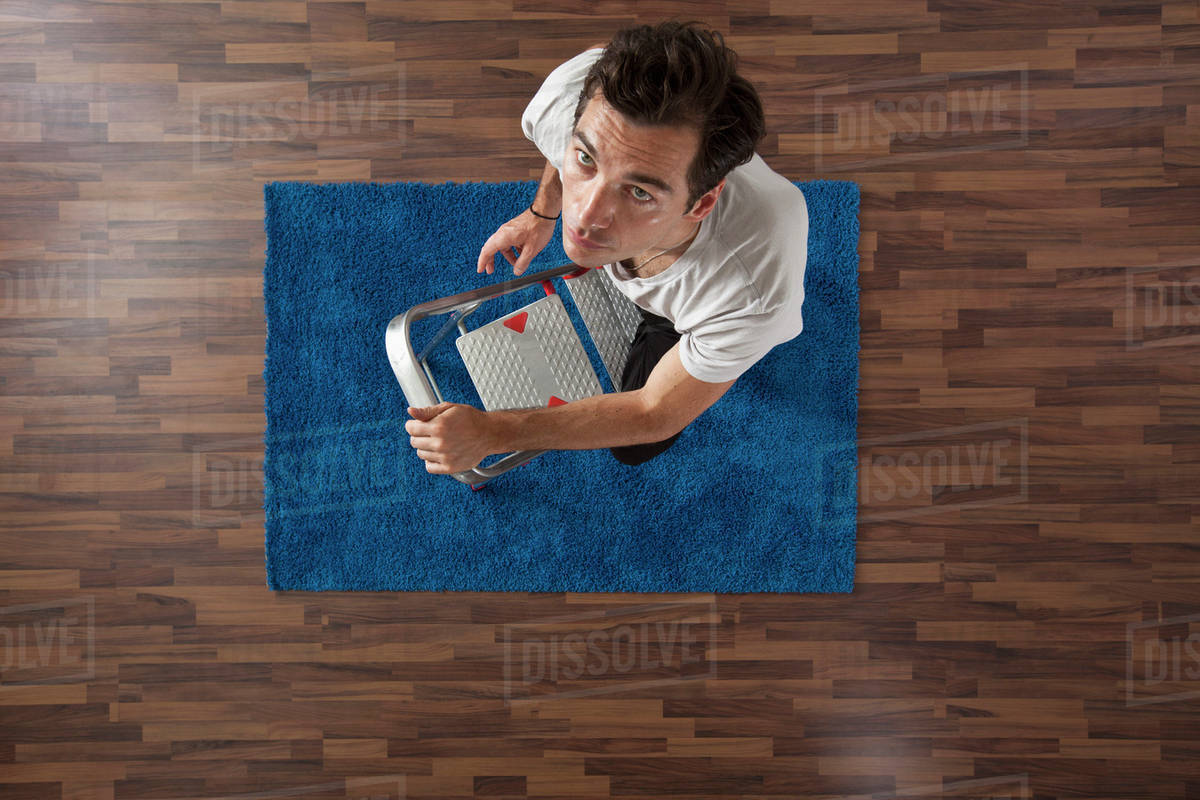 Man climbing a ladder looking up, overhead view - Royalty-free Stock ...